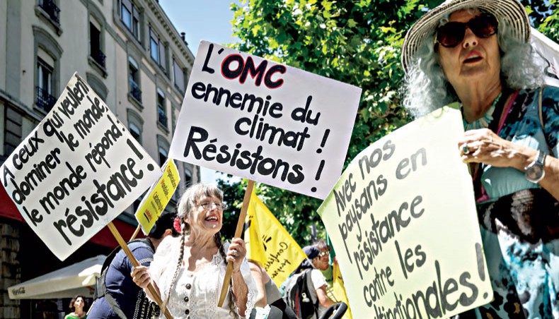 New Age | Protesters march against WTO role in agriculture