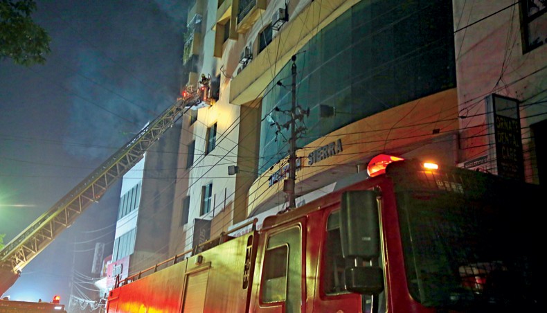 New Age | Nine-storey building catches fire in city